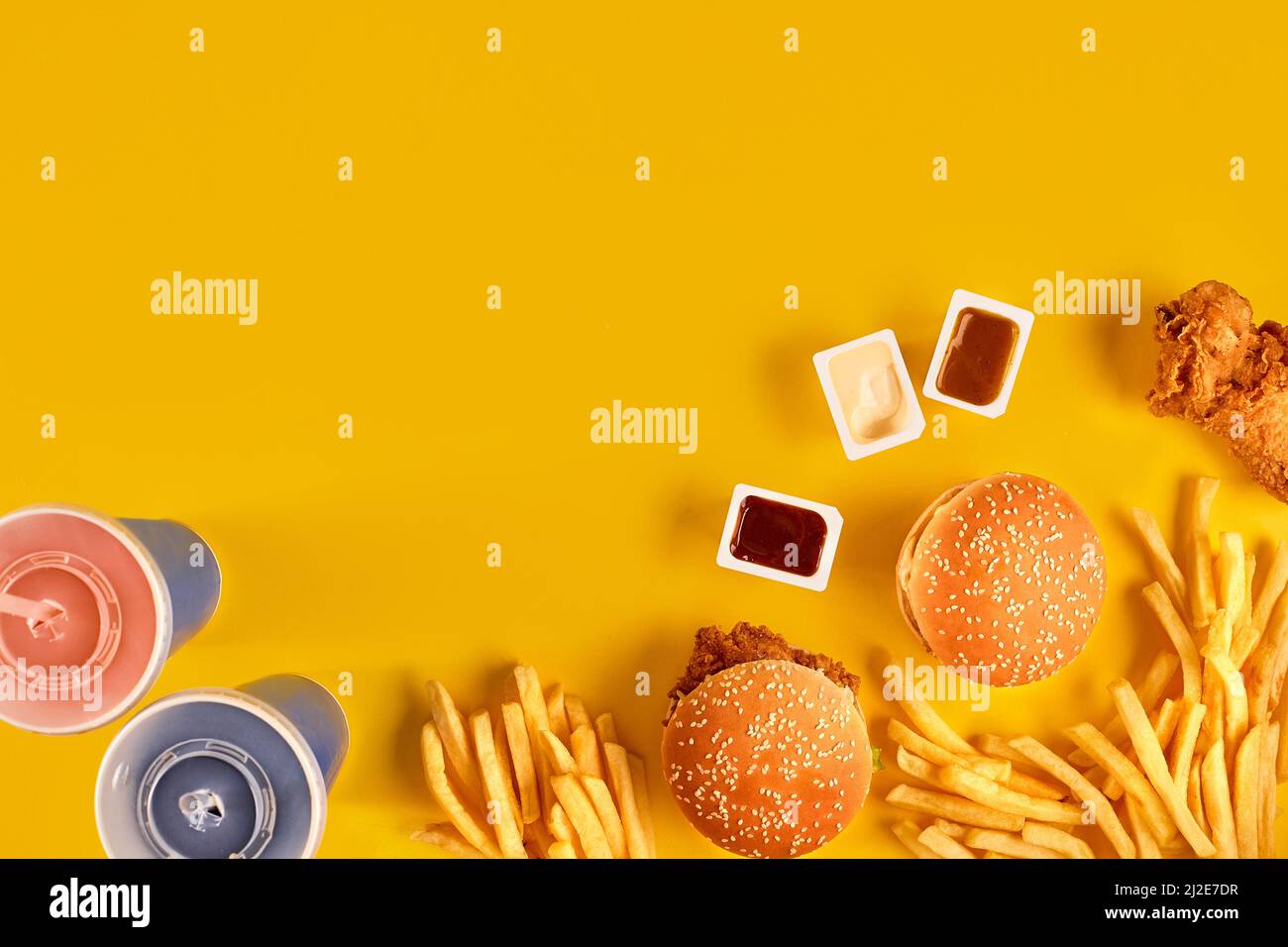 Fast food dish top view. Meat burger, potato chips and wedges. Take ...