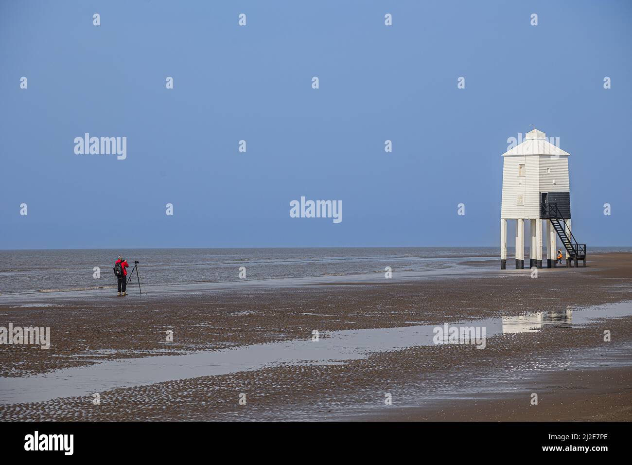 A Photographer taking a photograph of the Low Lighthouse in Burnham-on ...