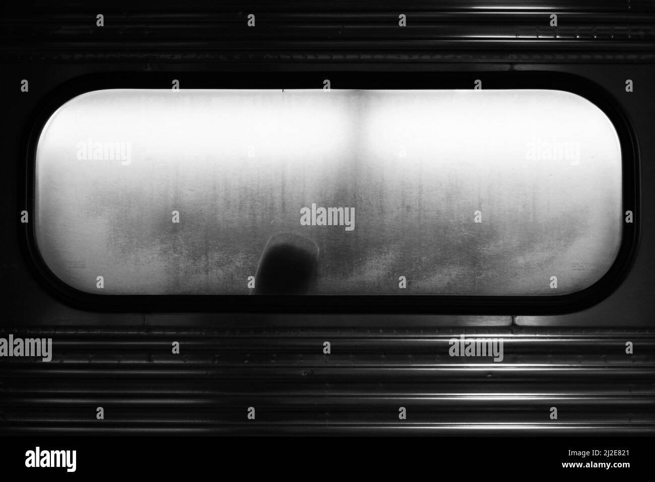 The dirty window of a public train car in black and white Stock Photo ...