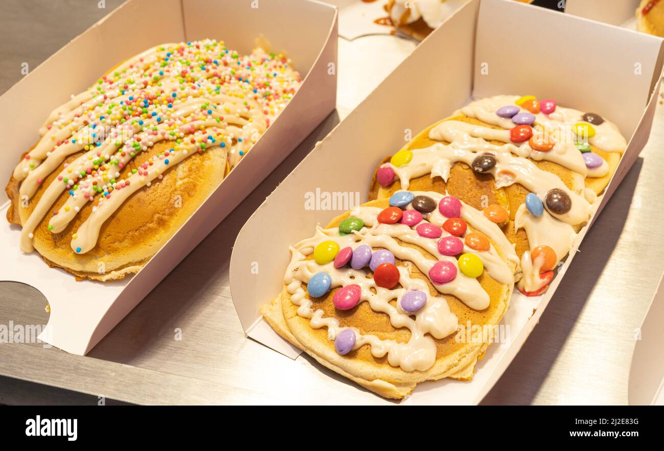 Pancakes with colorful toppings on showcase. Brussels Stock Photo - Alamy