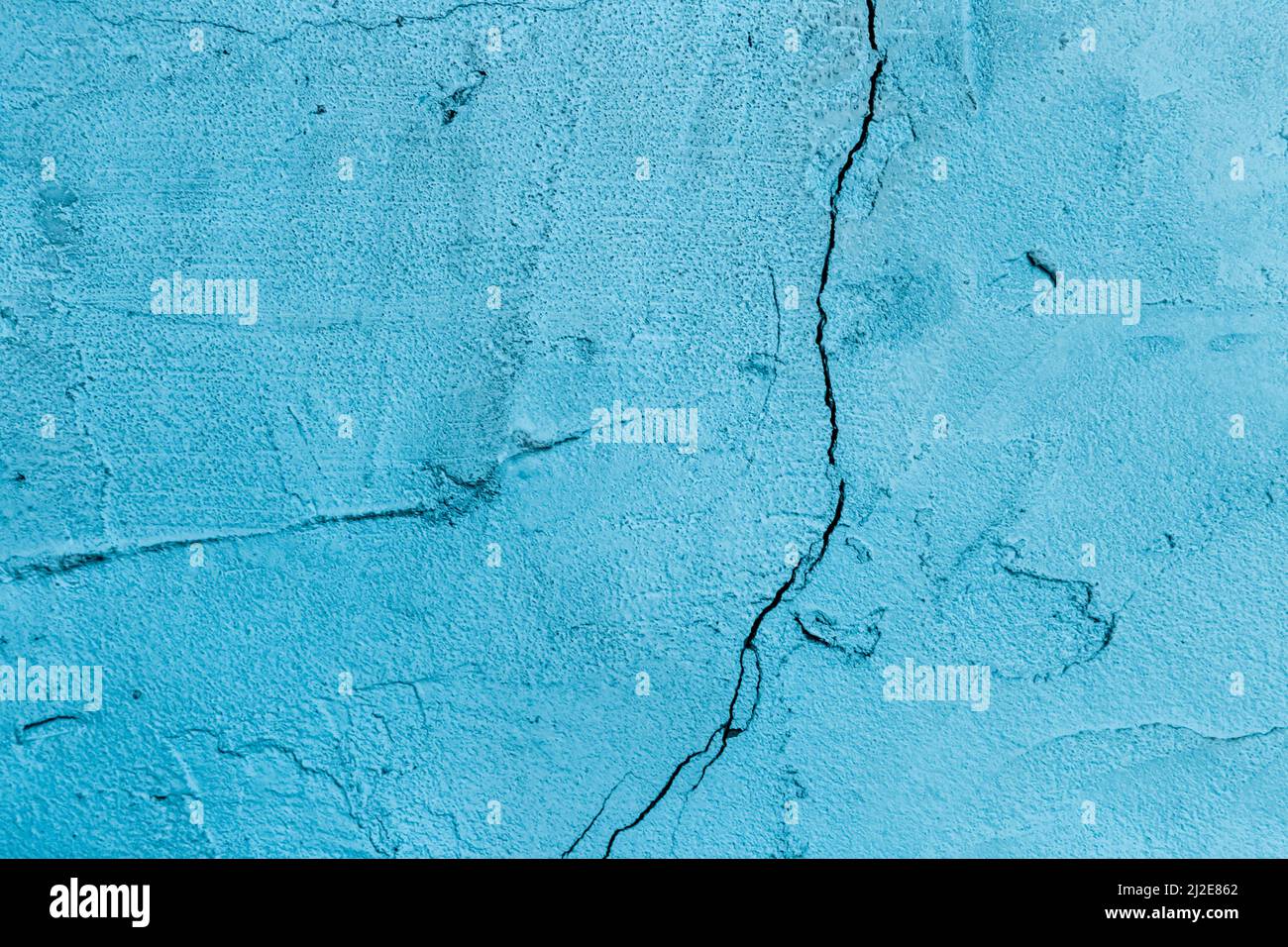 Crack on old dirty blue paint concrete wall of cement surface broken ...