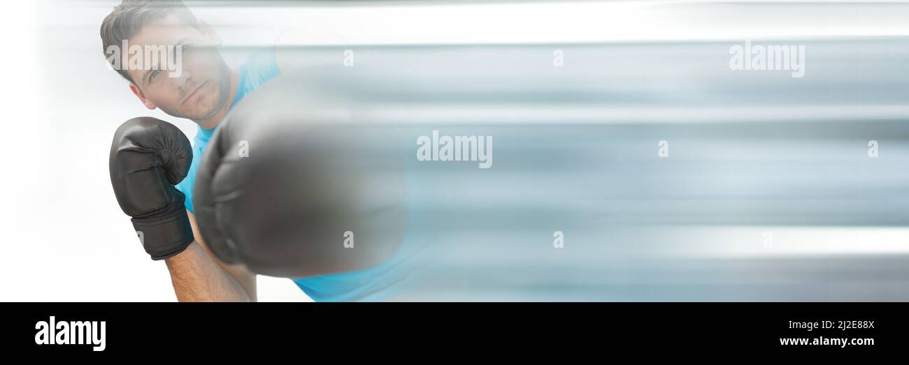 Blur effect with copy space against portrait of caucasian male boxer ...