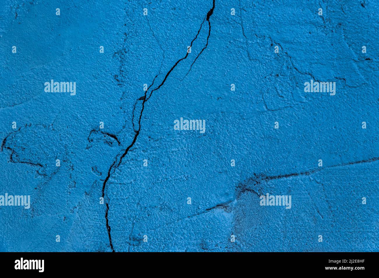 Crack on old dirty blue paint concrete wall of cement surface broken ...