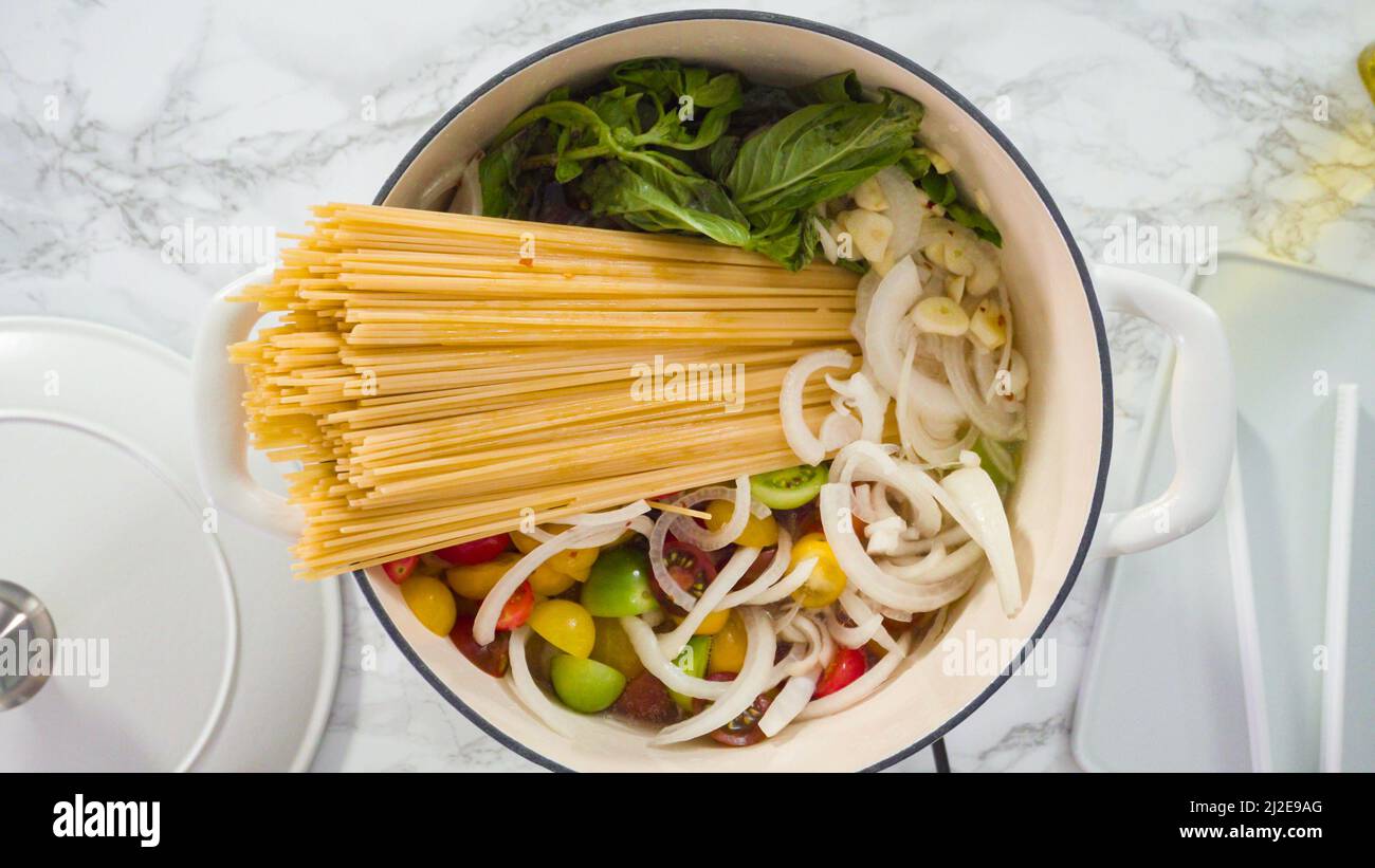 Flat lay. Step by step. Cooking on pot pasta recipe in an enameled cast ...