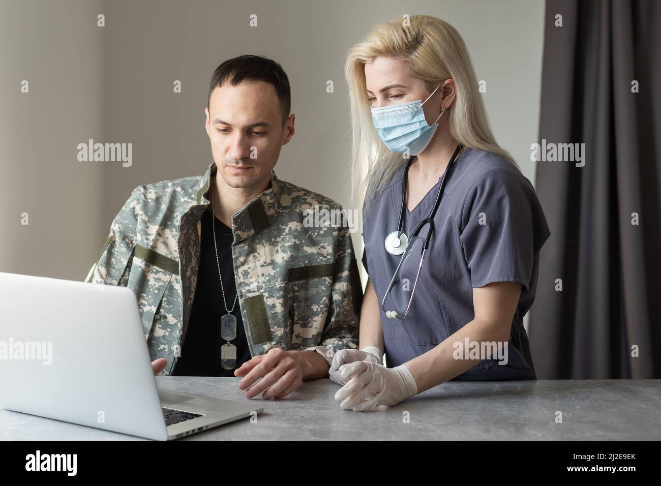 medical worker with military officer patient in hospital Stock Photo ...