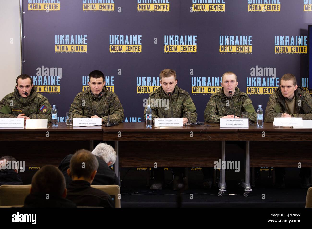 Russian soldiers now prisoners speak during a press conference at the ...