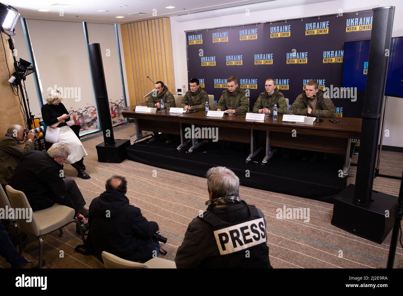 Russian soldiers now prisoners speak during a press conference at the ...