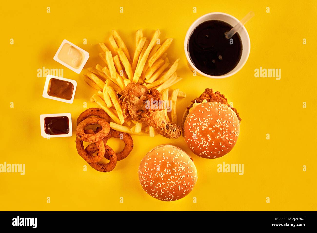 Fast food concept with greasy fried restaurant take out as onion rings ...