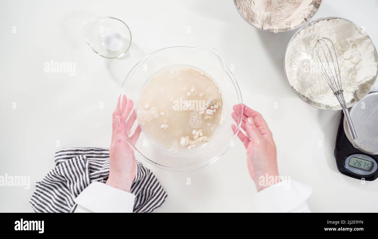 Flat lay. Measuring ingredients into a glass bowl to bake cinnamon ...
