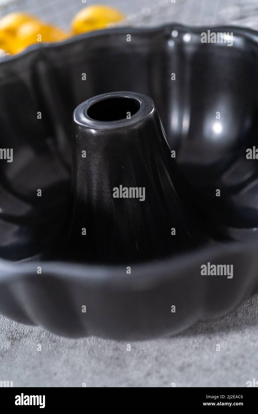 Empty baking pan prepared to bake a lemon pound cake Stock Photo - Alamy