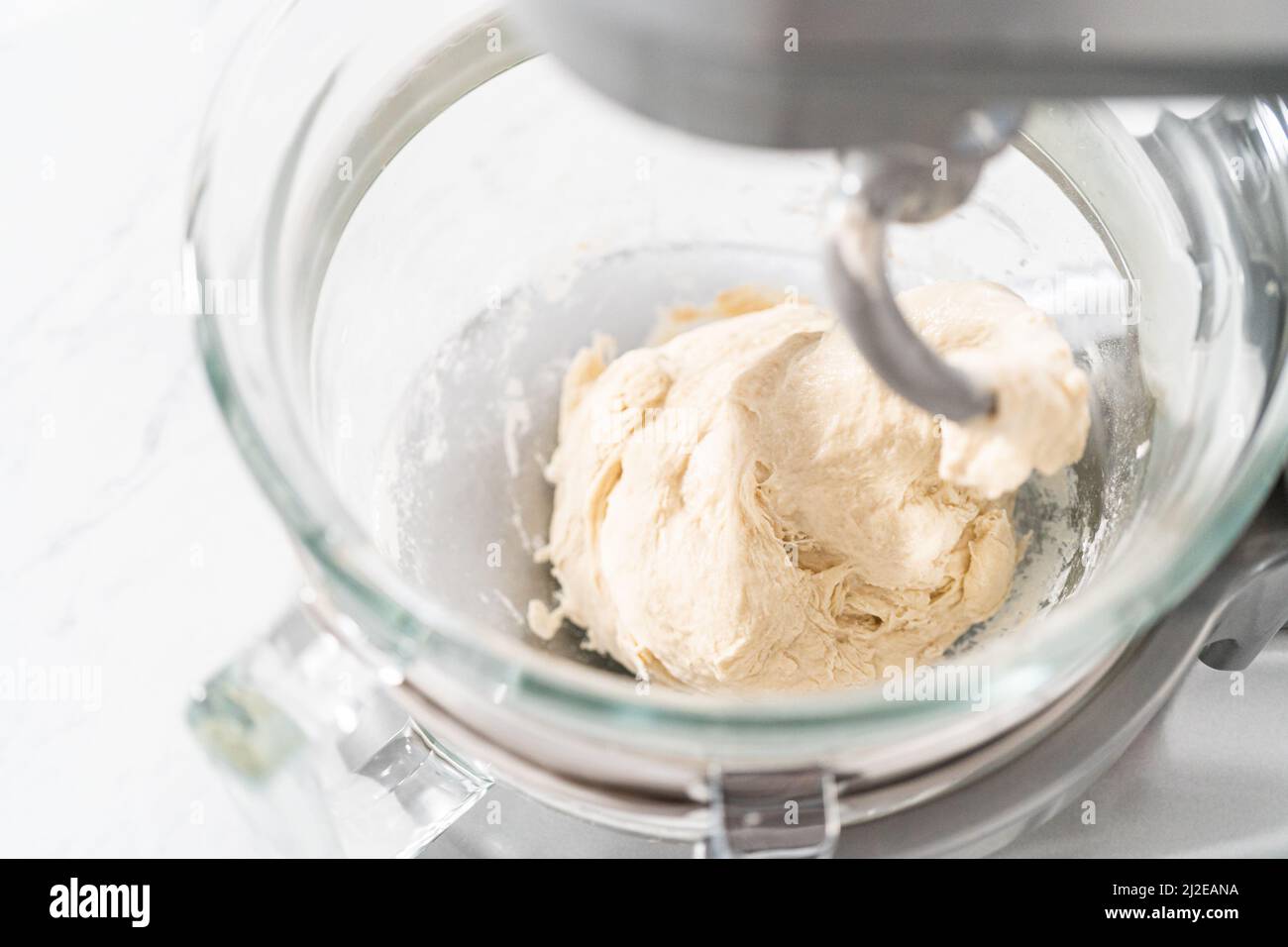 Mixing bread dough in a stand-alone kitchen mixer to bake patriotic ...