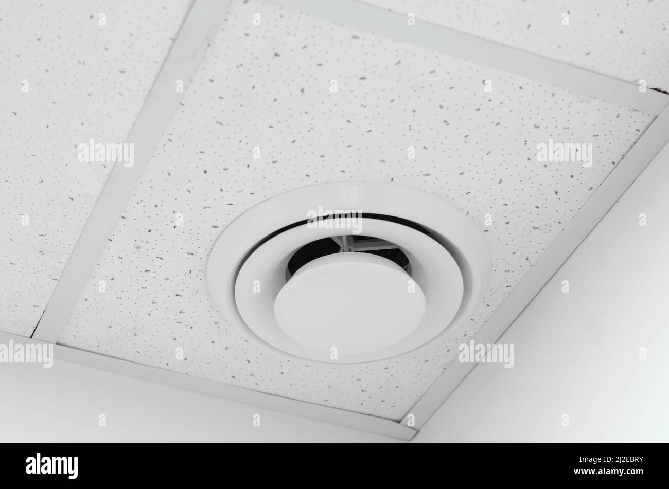 Round ventilation duct on the ceiling. Modern ventilation built into ...