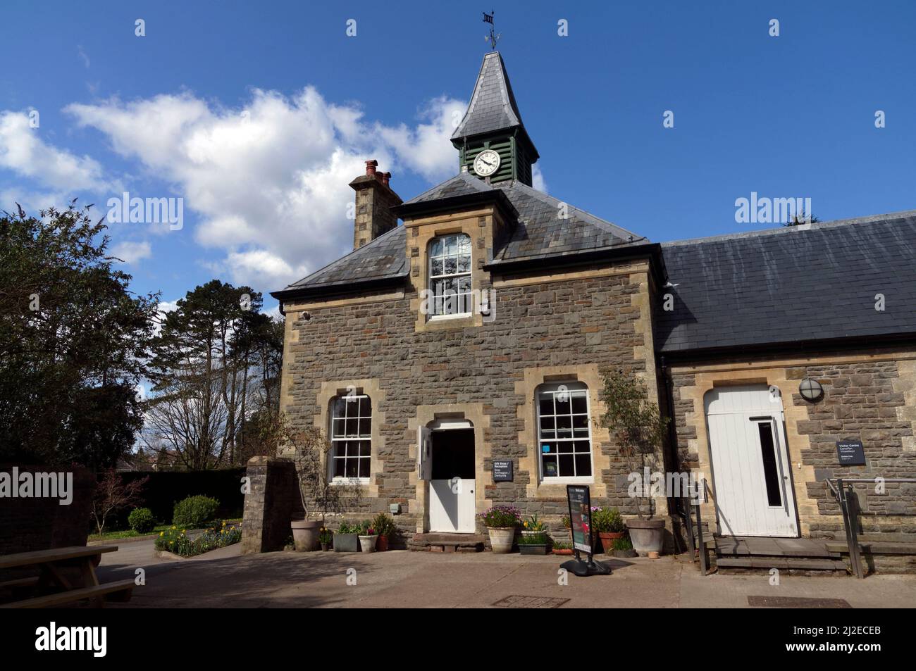 Attractive stone outbuilding with clock tower, stable style door and ...