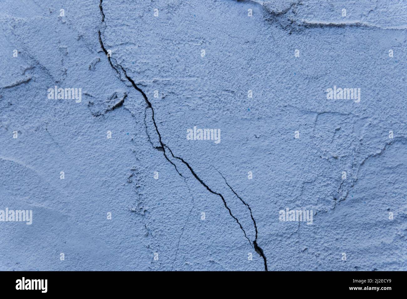 Crack on old dirty blue paint concrete wall of cement surface broken ...