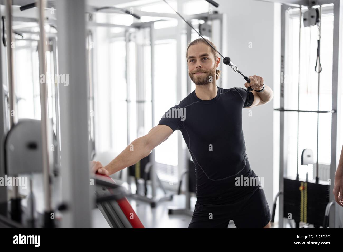 Man doing exercise on decompression simulator at rehabilitation center ...