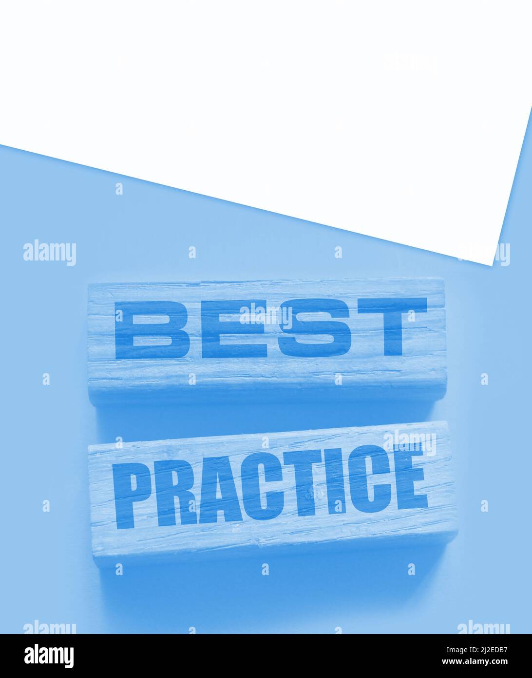 best practice words on wooden blocks on yellow. Business and healthcare ...