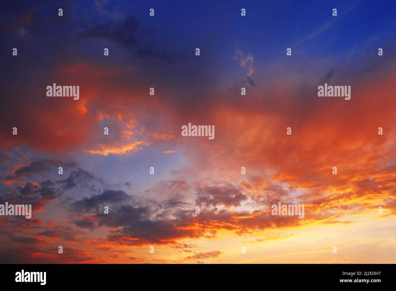 Beautiful sunset, clouds in many colors Stock Photo - Alamy