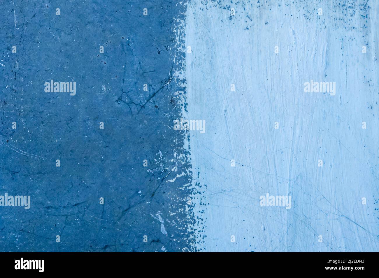 White paint brush stroke spots two color on old concrete blue surface ...