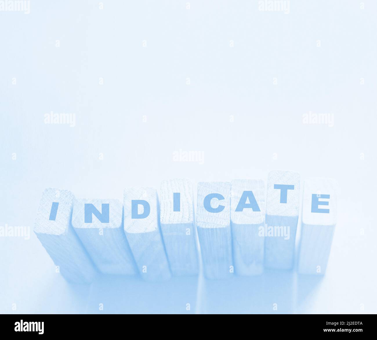 Indicate word on wooden blocks on cyan background. Financial indicator ...