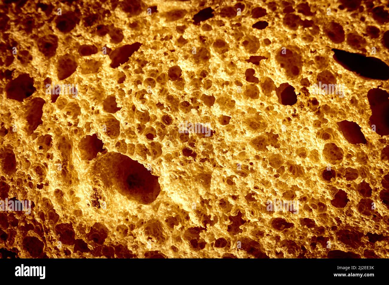 texture of brown bread as a close up background. backdrop of rough ...