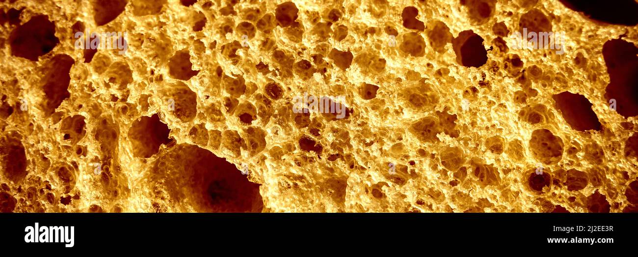 texture of brown bread as a close up background. backdrop of rough ...