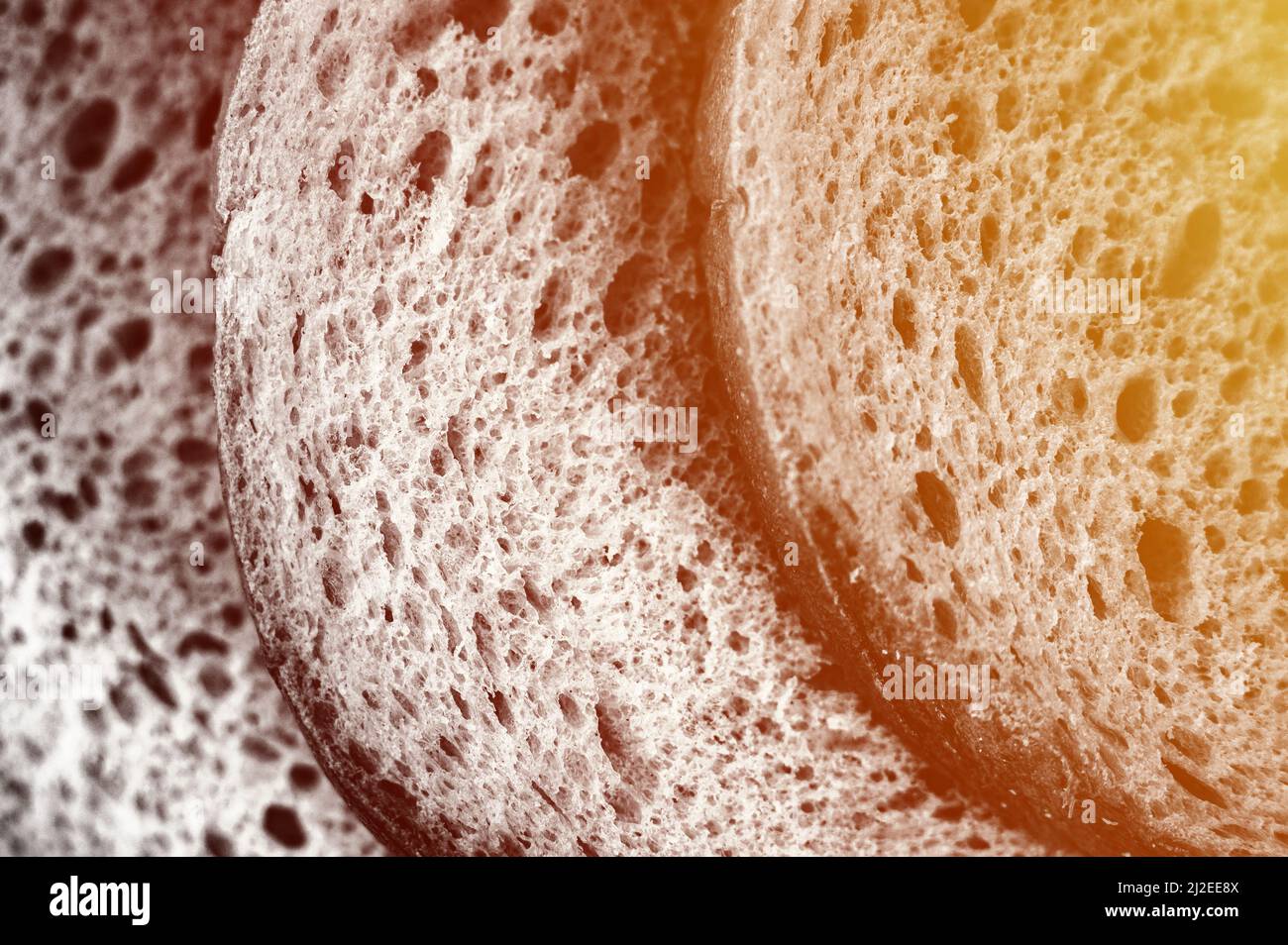 texture of slices white bread as a close up background. gray backdrop ...