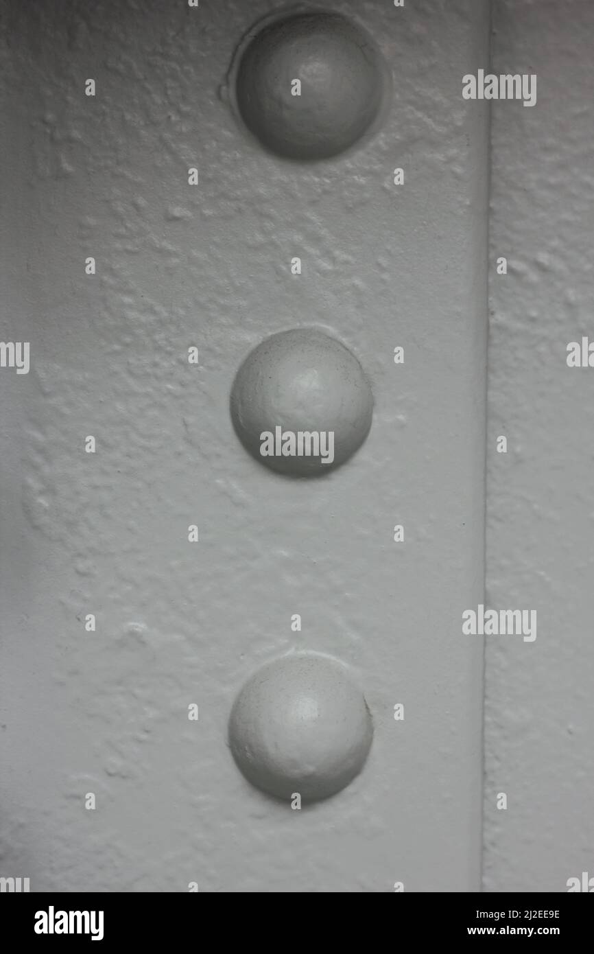 A solid structural steel bolted connection with lots of bolts and ...