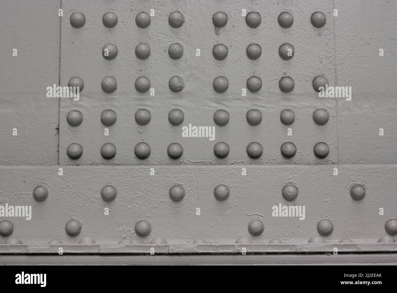 A solid structural steel bolted connection with lots of bolts and ...