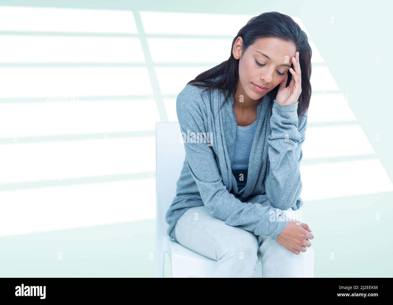 Stressed african american woman sitting on a chair against copy space ...