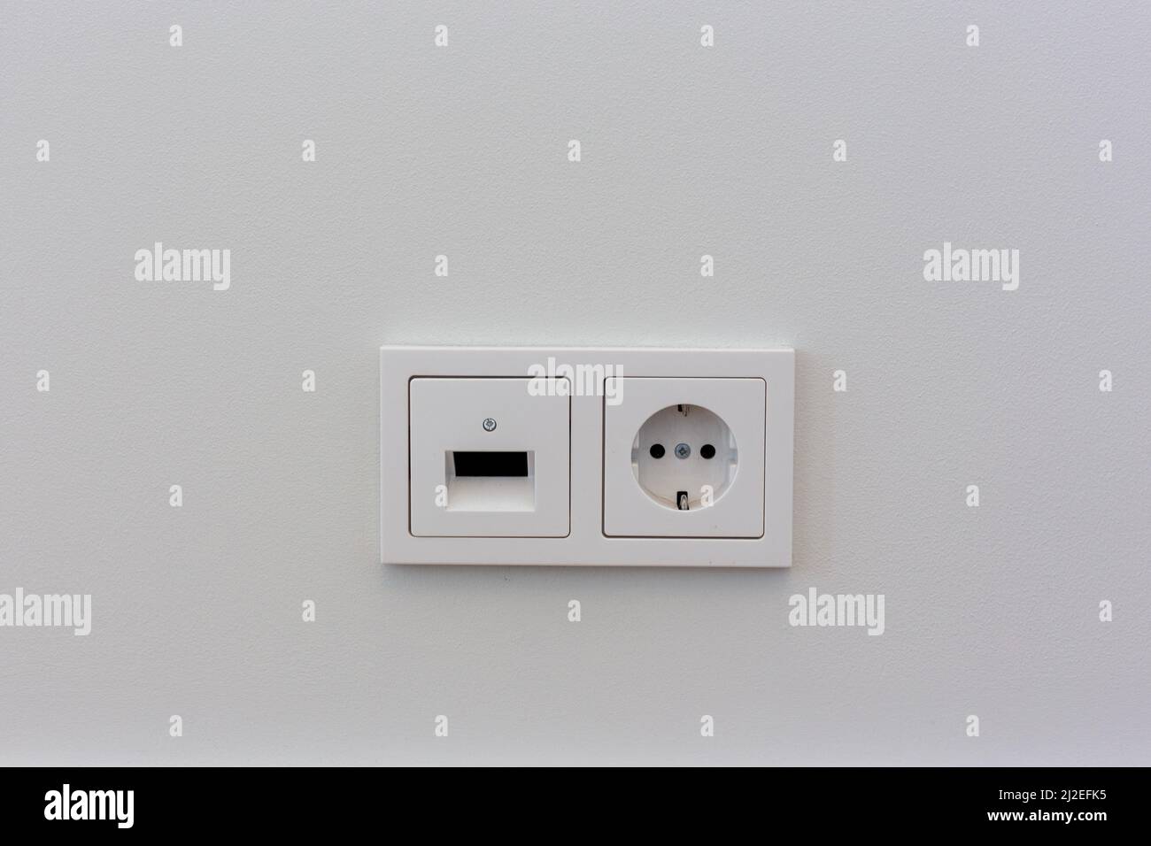Double electrical socket on a white wall in the room Stock Photo - Alamy
