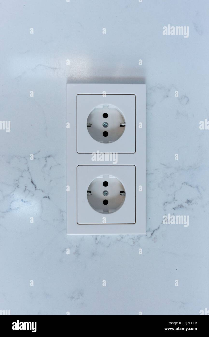 Double electrical socket on a white wall in the room Stock Photo - Alamy