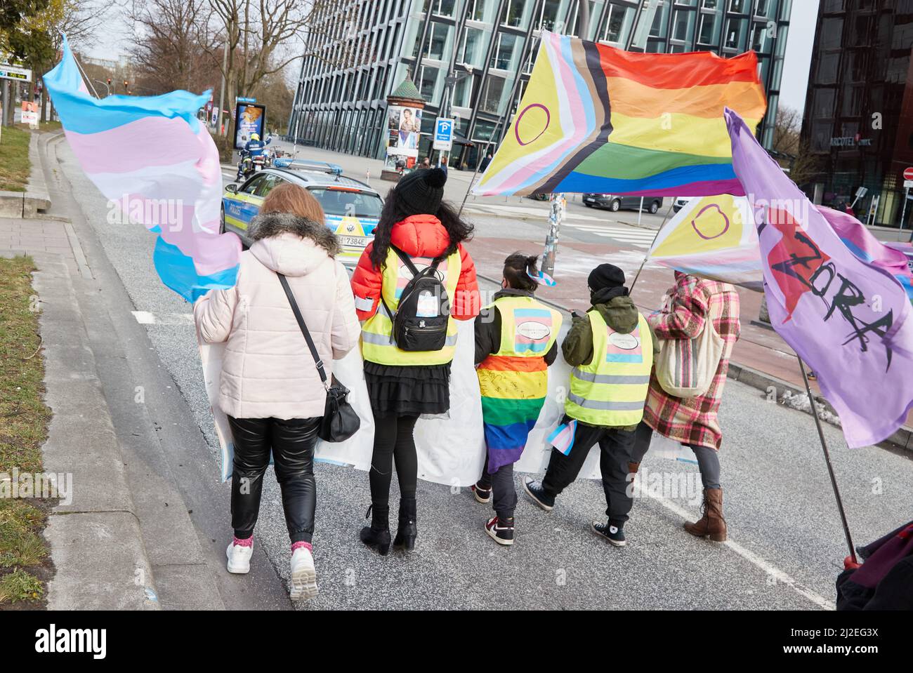 Hamburg, Germany. 31st Mar, 2022. Participants hold a transgender flag ...