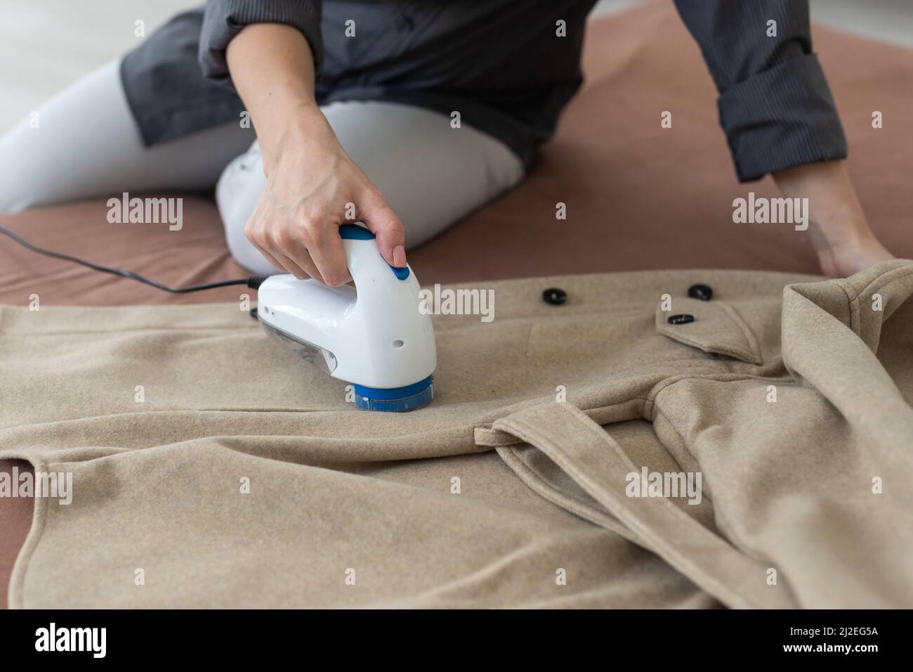 Woman Removing Clothes High Resolution Stock Photography and Images - Alamy