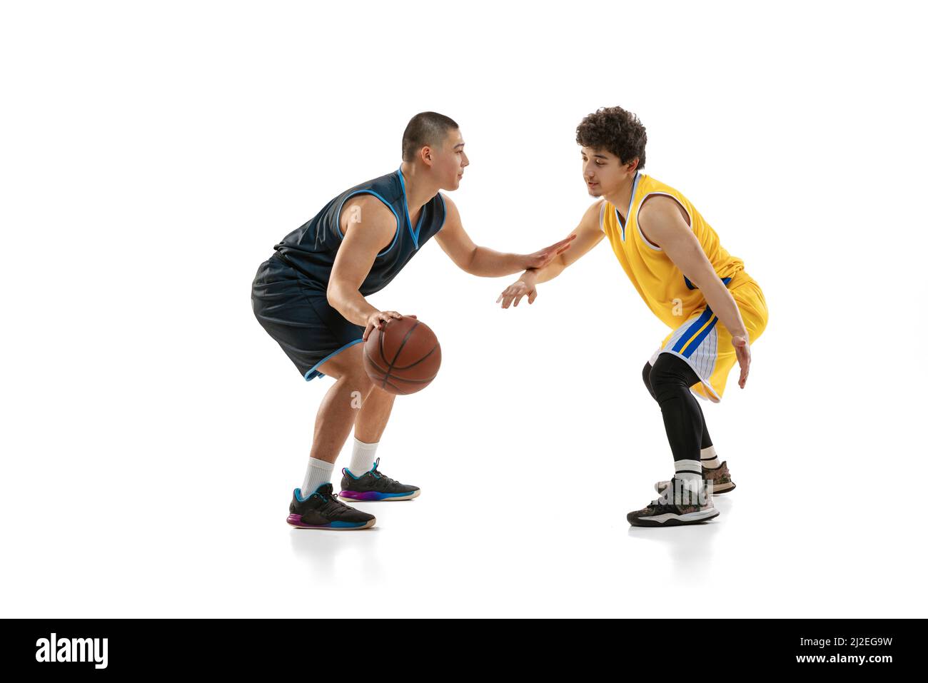 Dynamic portrait of two young basketball players playing basketball ...