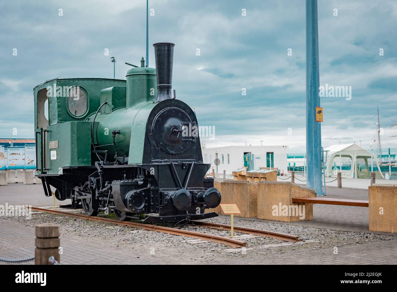 Old small steam locomotive on a display at the port in Reykjavik, as a ...