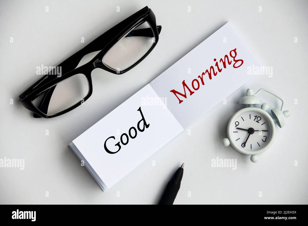 Good morning text on notepad with pen and Glasses. Morning greeting ...