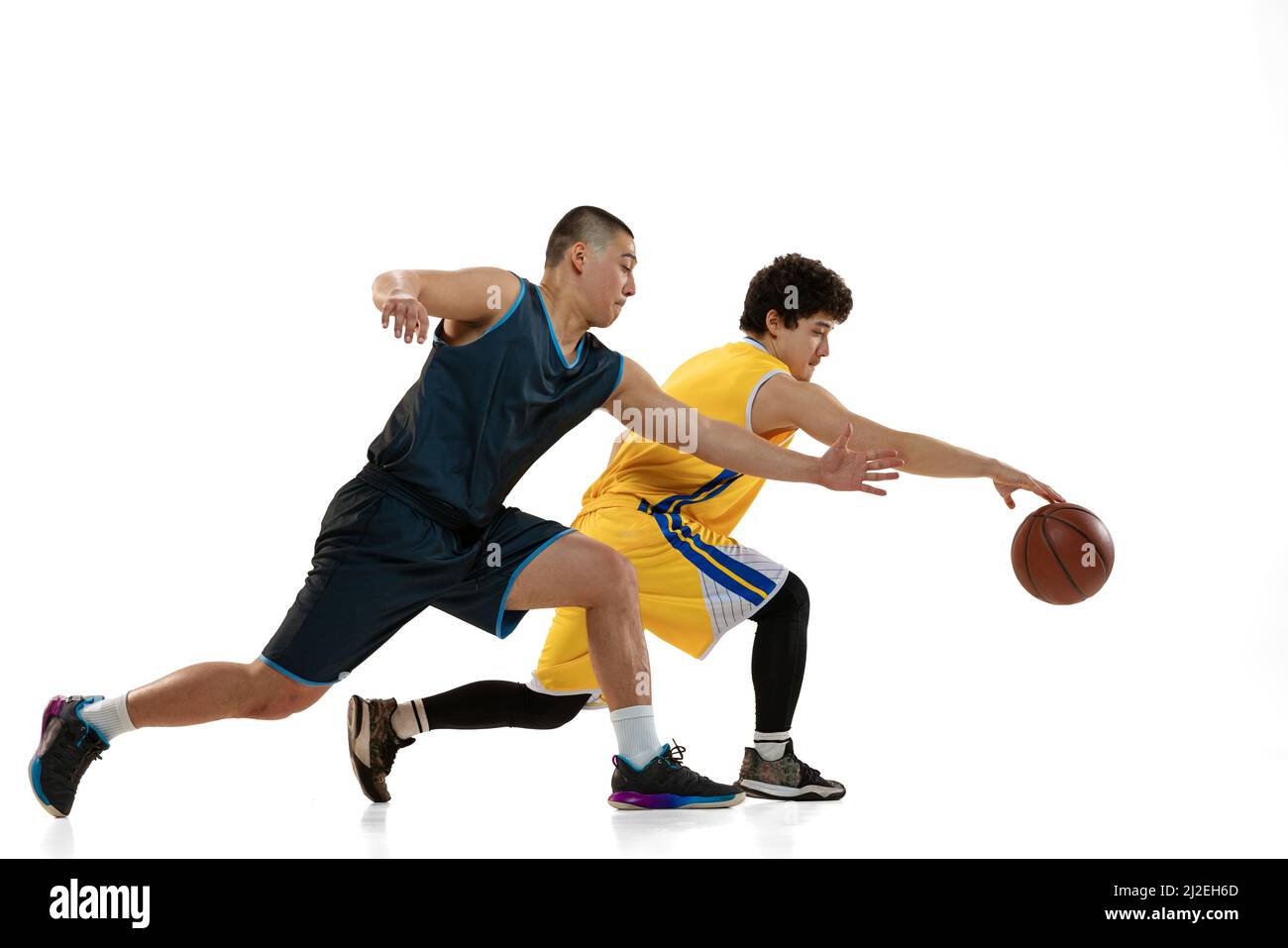 Dynamic portrait of two young basketball players playing basketball ...