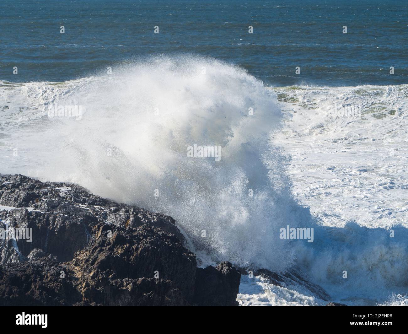 Wild sea waves crashing and splashing, water cascading over rocks ...