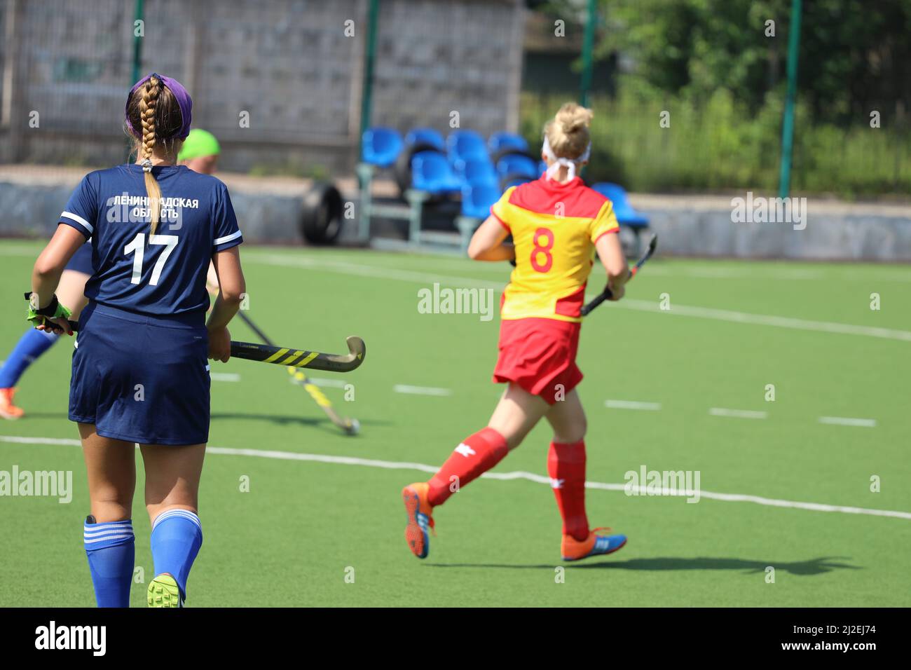 Female hockey player hitting ball hi-res stock photography and images ...