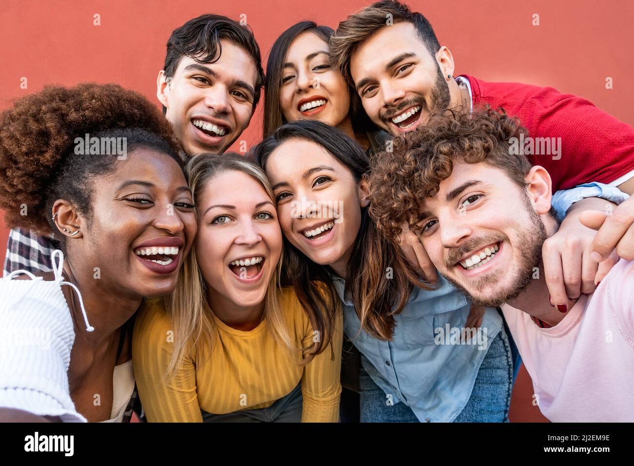 Young multiracial friends having fun together hanging out in the city ...