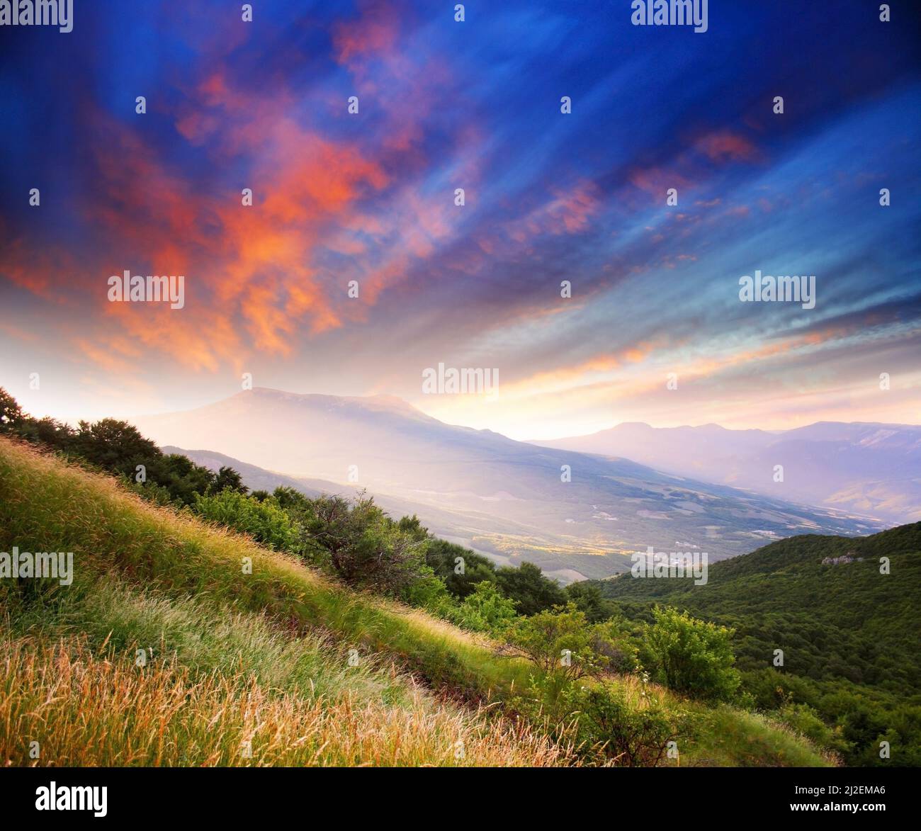 Landscape with mountains under morning sky with clouds Stock Photo - Alamy