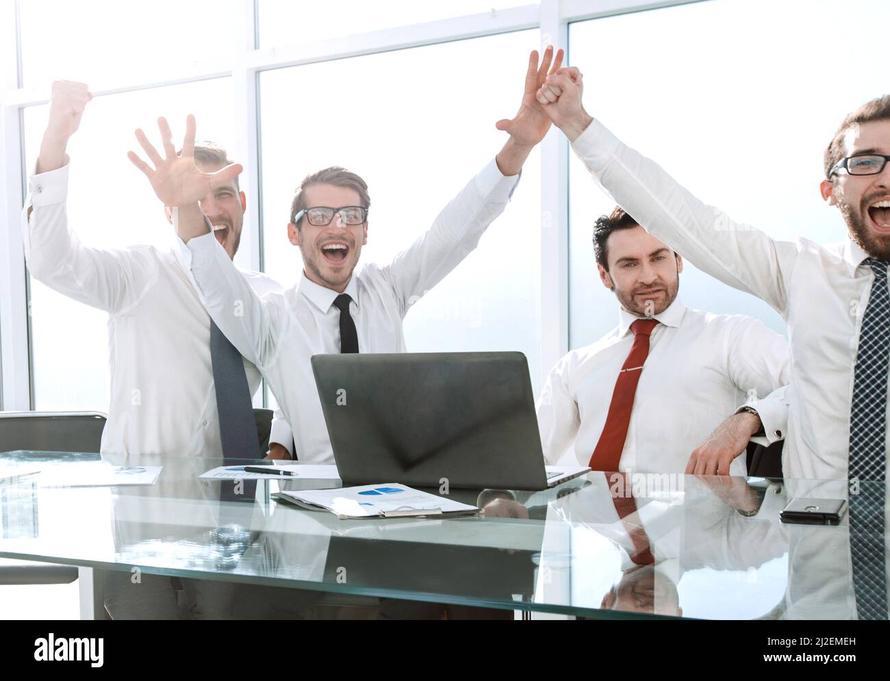 happy team showing their success Stock Photo - Alamy
