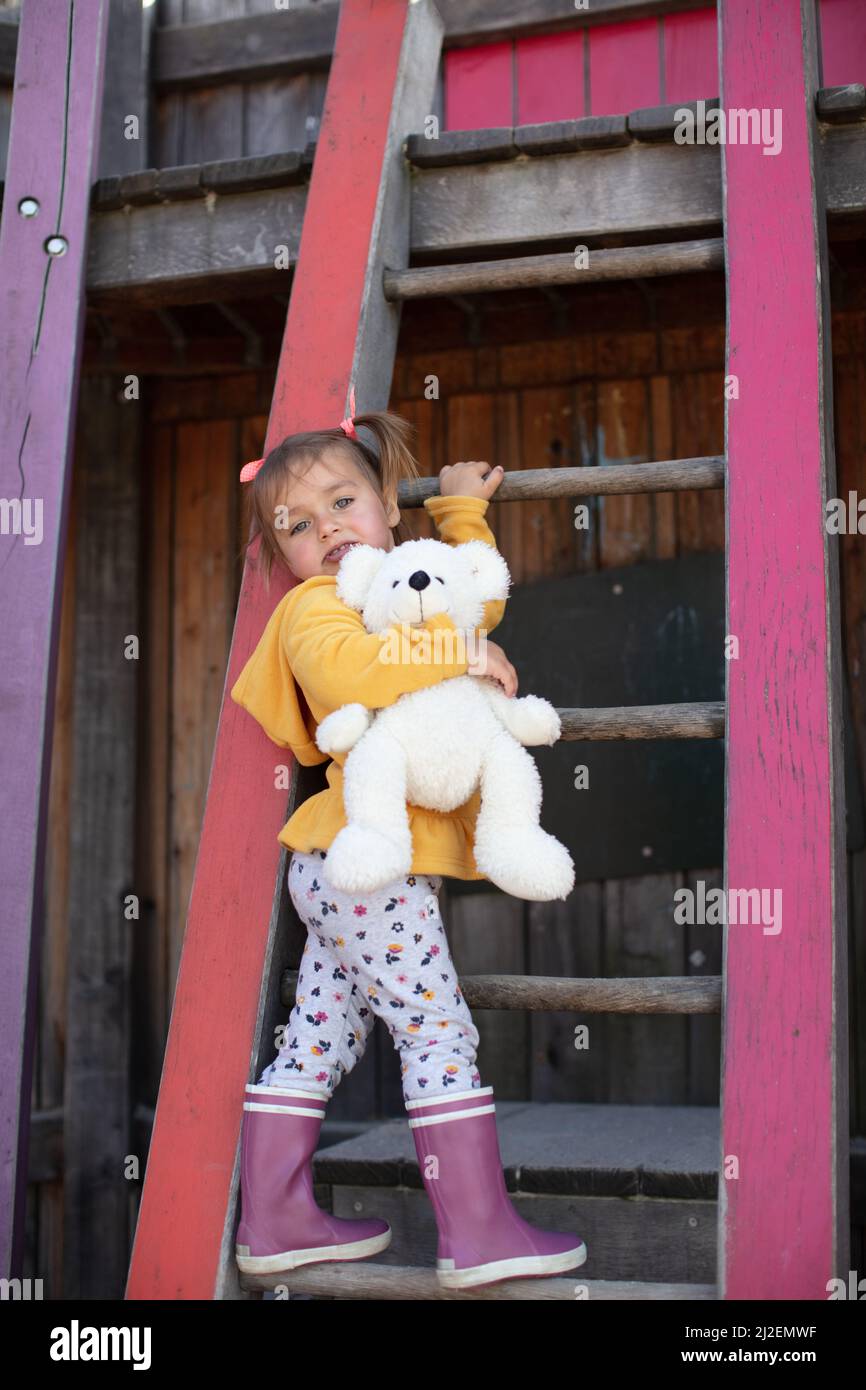 Outdoor kids activity at the playground. Toddler's friendship with toy ...