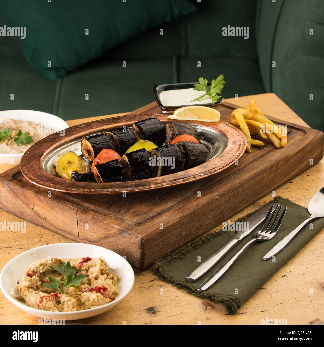 A dining table full of delicious dishes on a wooden desk Stock Photo ...