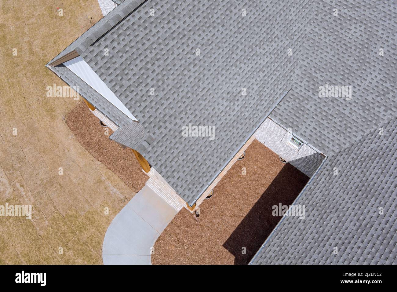 Aerial view rooftop construction the edge of roof shingles on top of ...