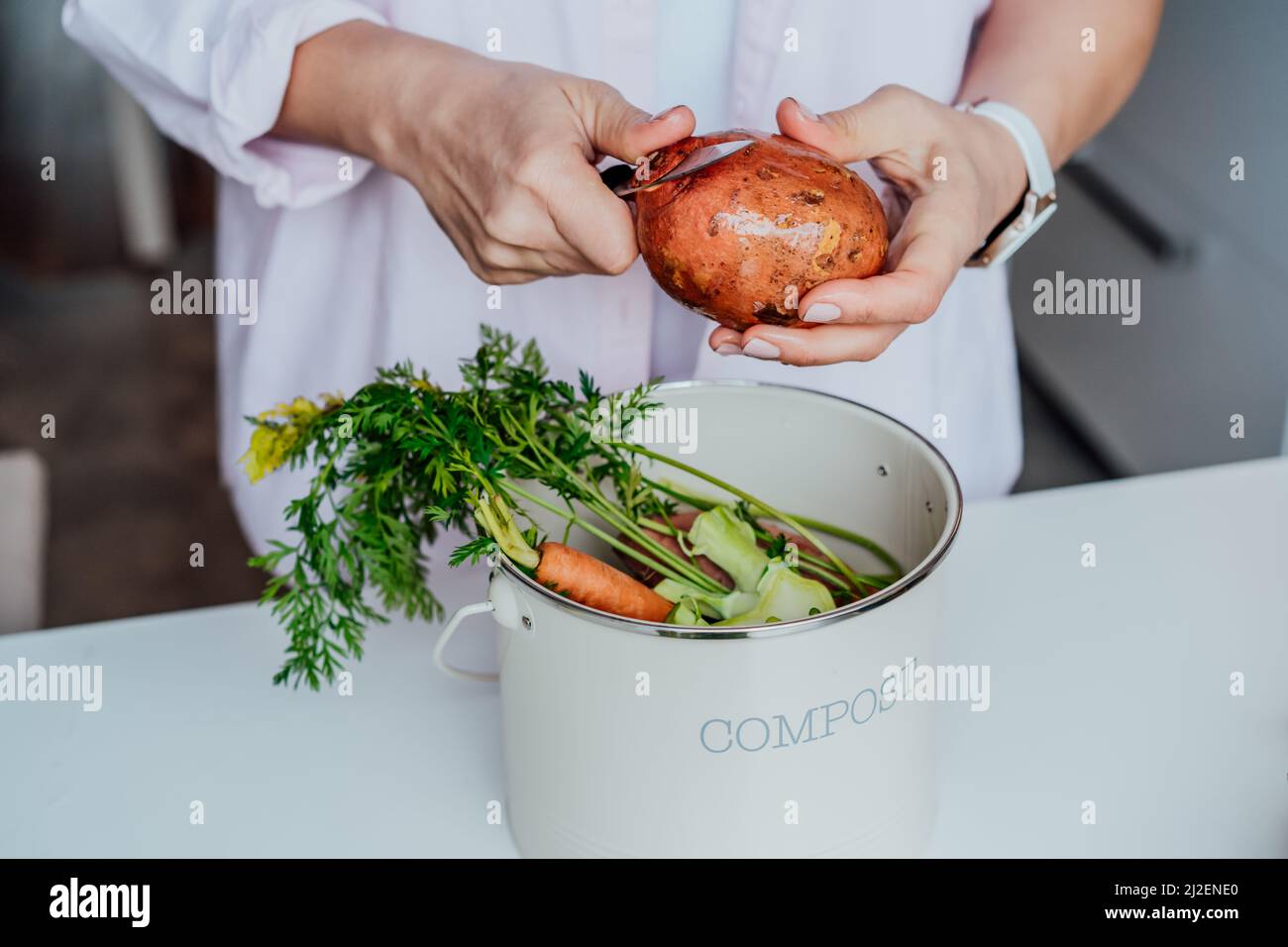 Compost the kitchen waste, recycling at home. Woman cleaning sweet ...