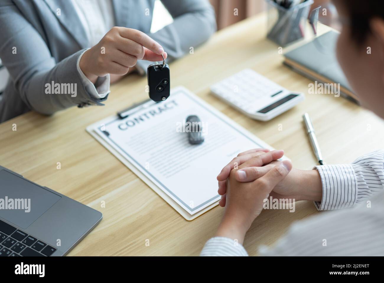 Insurance concept the car dealer explaining the conditions of the car ...