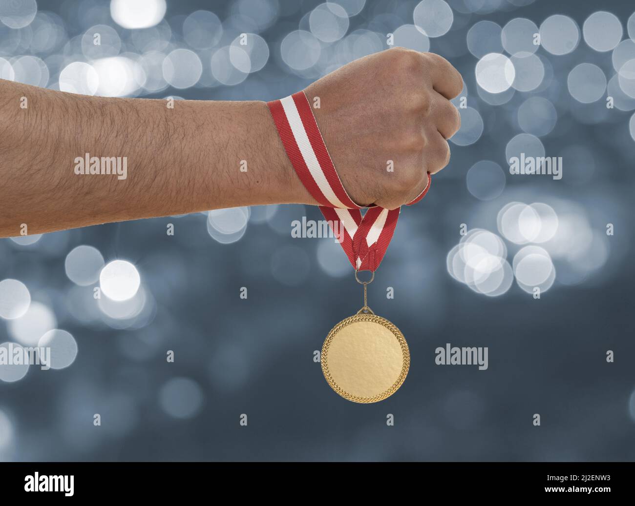 Man raising hand and holding gold medal. Concept of ambition ...