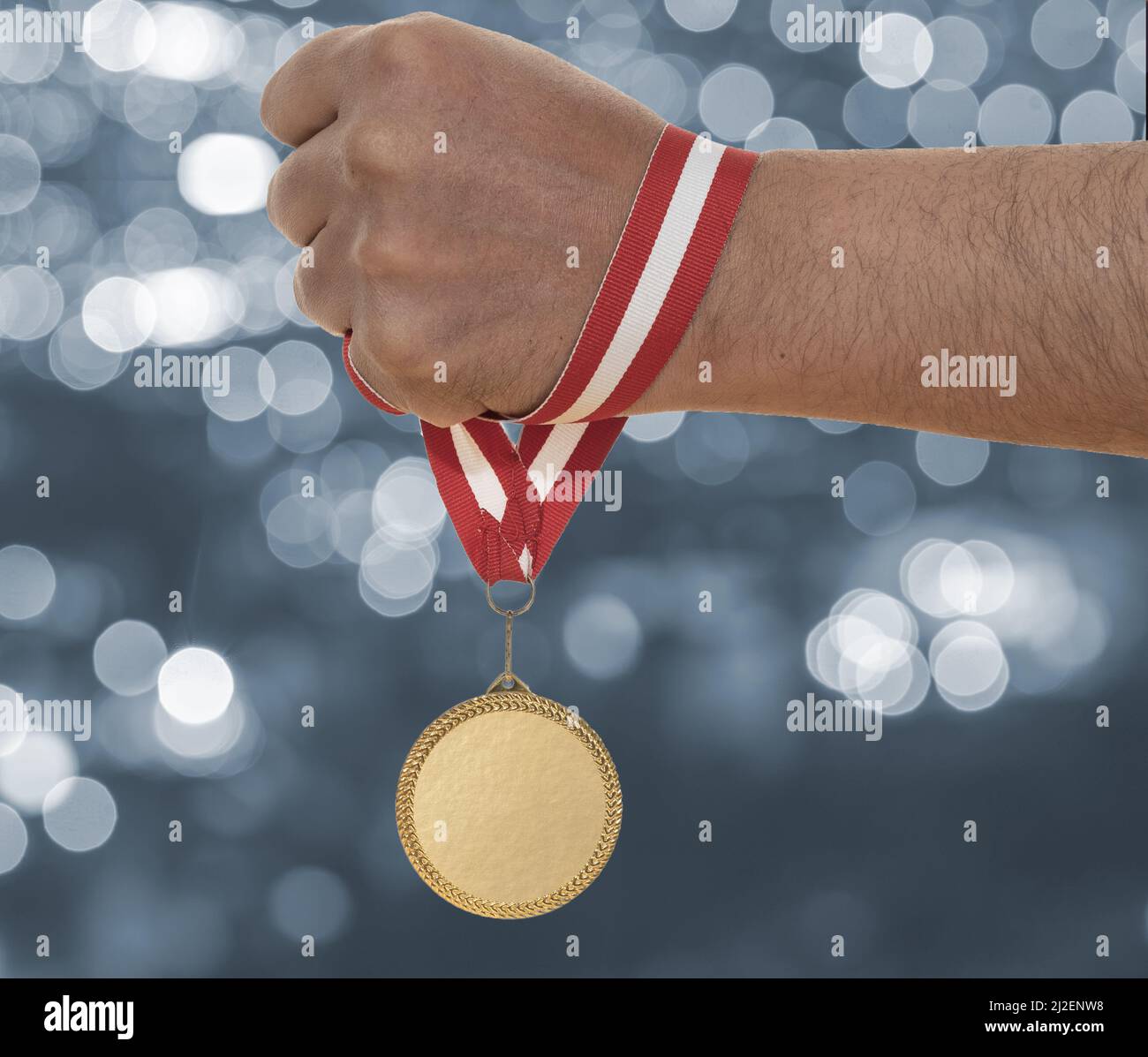 Man raising hand and holding gold medal. Concept of ambition ...