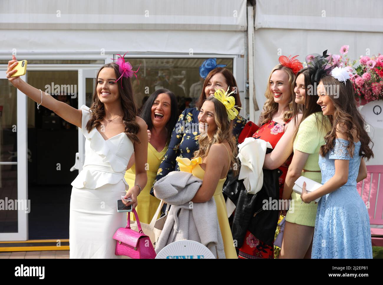 Racegoers pose for a selfie during the Coral Scottish Grand National ...
